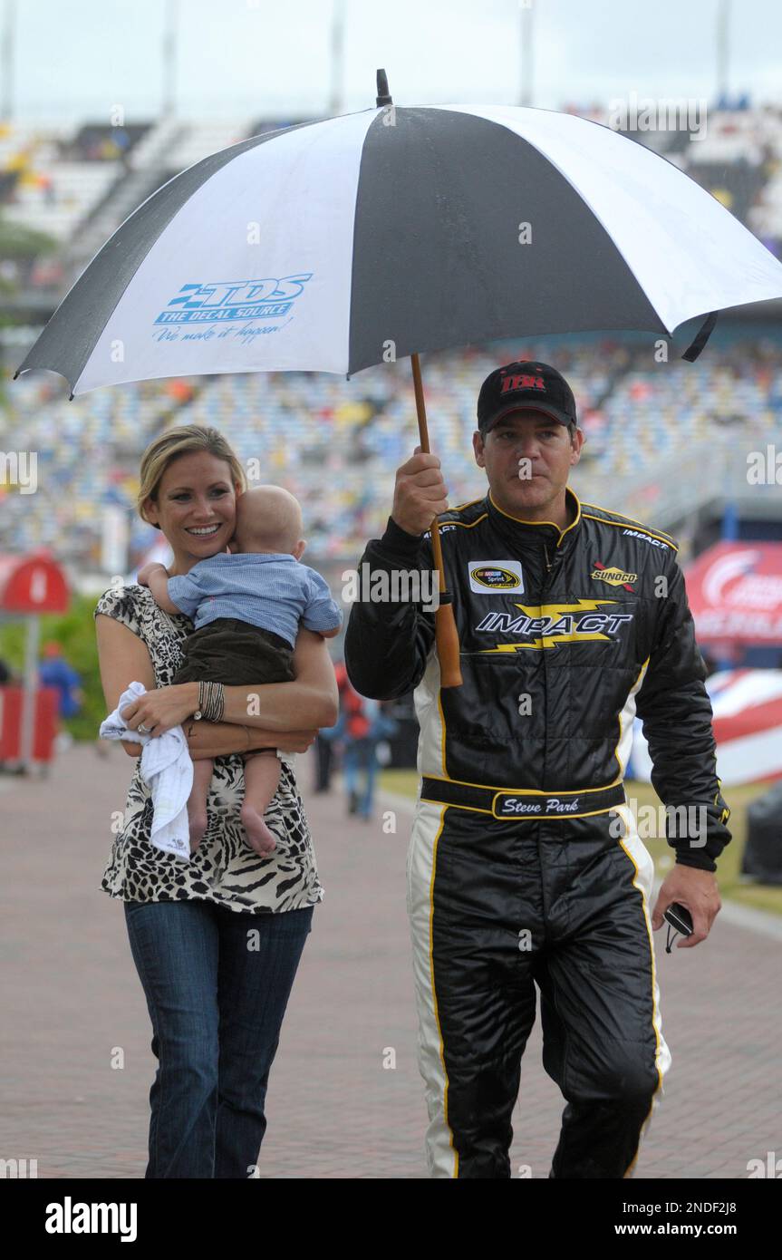 NASCAR driver Steve Park, right, walks back to the garage area with his ...