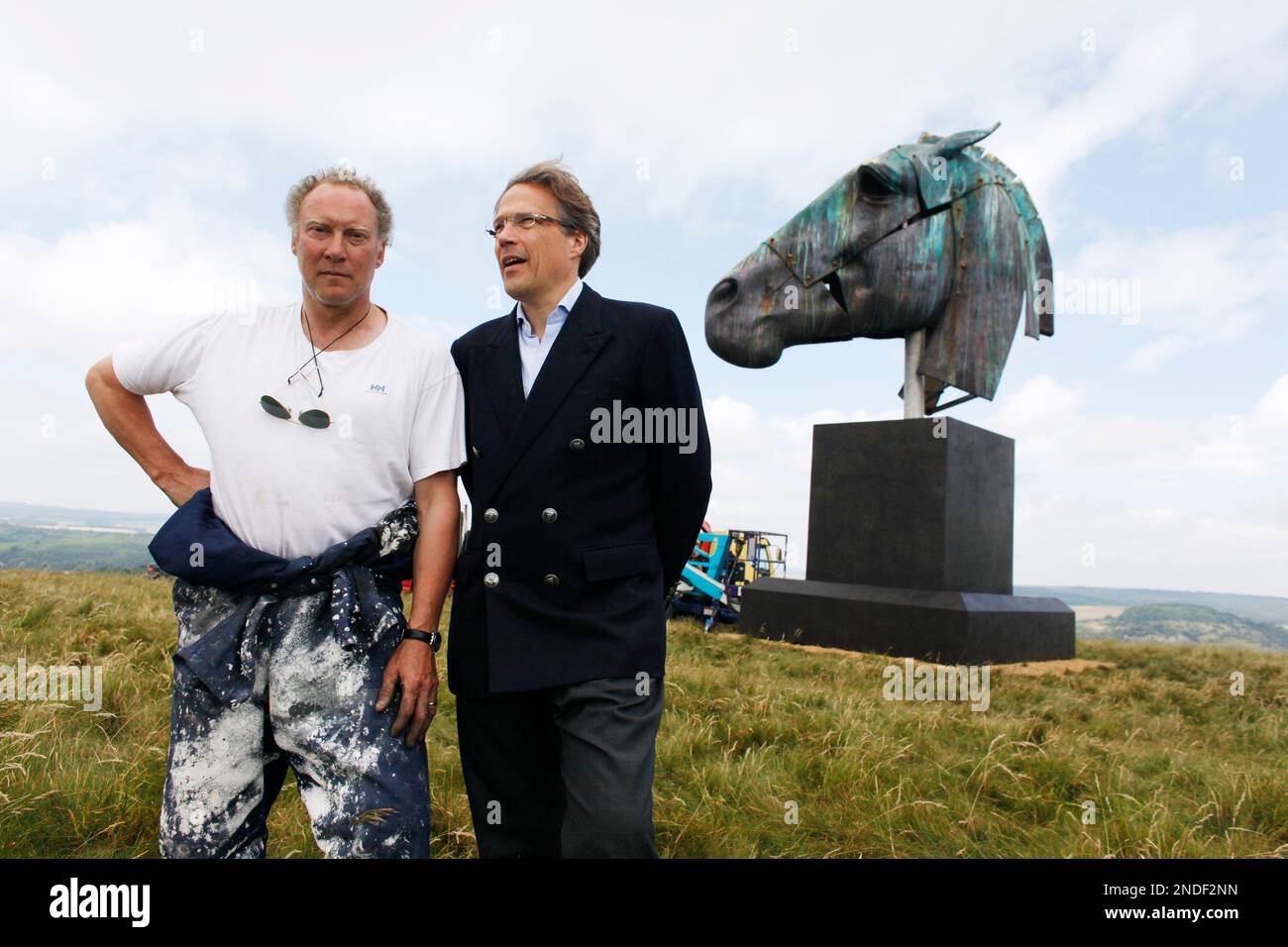 Artist Nic Fiddian-Green (L) and Lord March pose in front of a equine ...