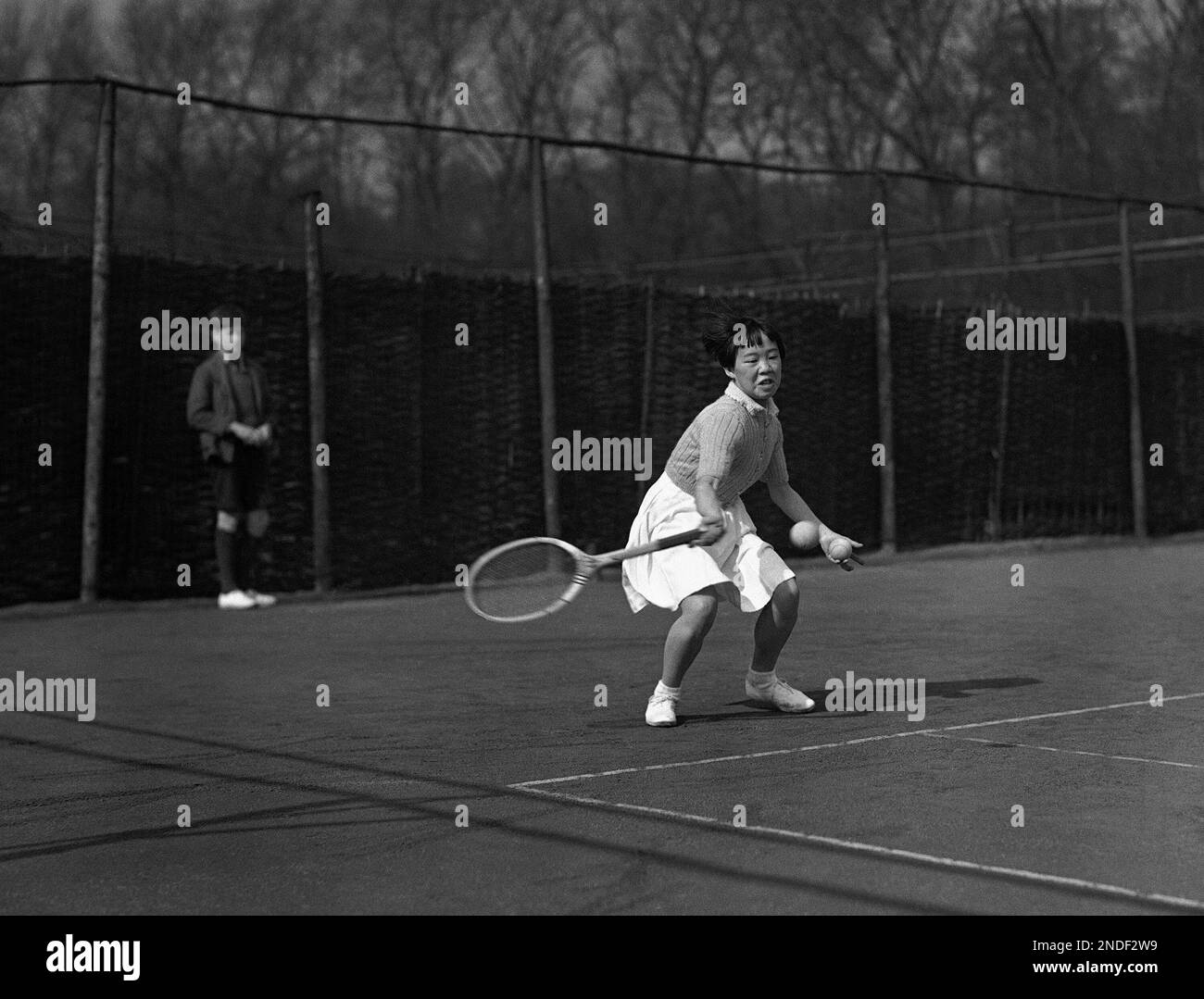Chinese tennis player Gem Hoahing, in play against Dorothy Round ...