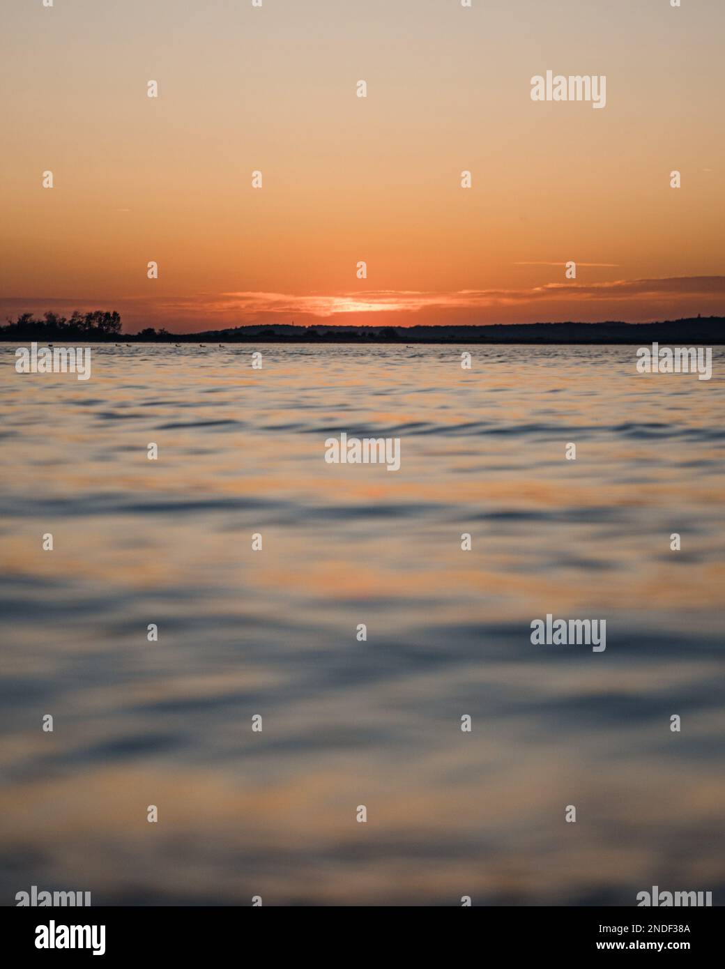 A beautiful vertical view of sea water under the clear sky during ...