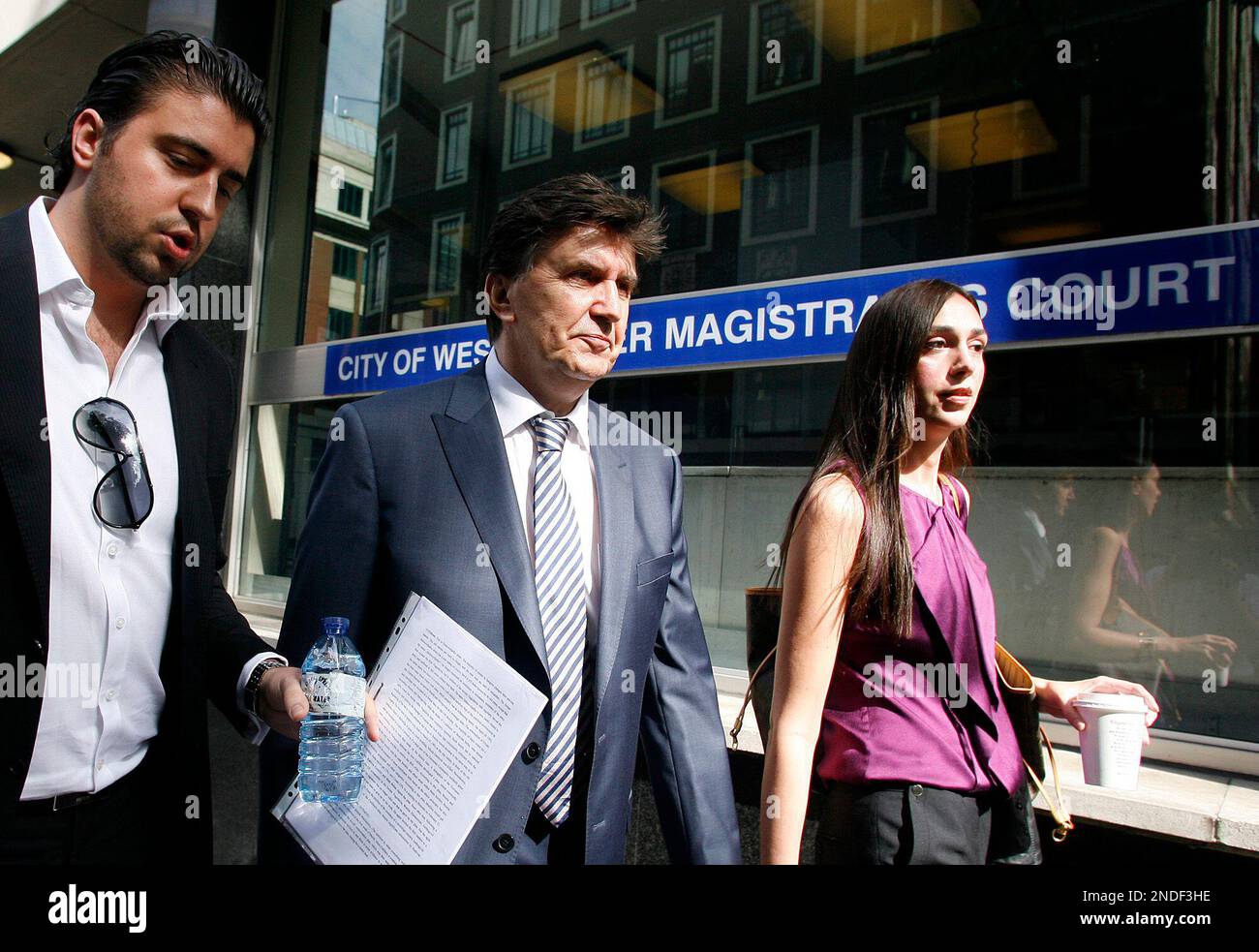 Former Bosnian president Ejup Ganic, center, arrives with his son Emir ...