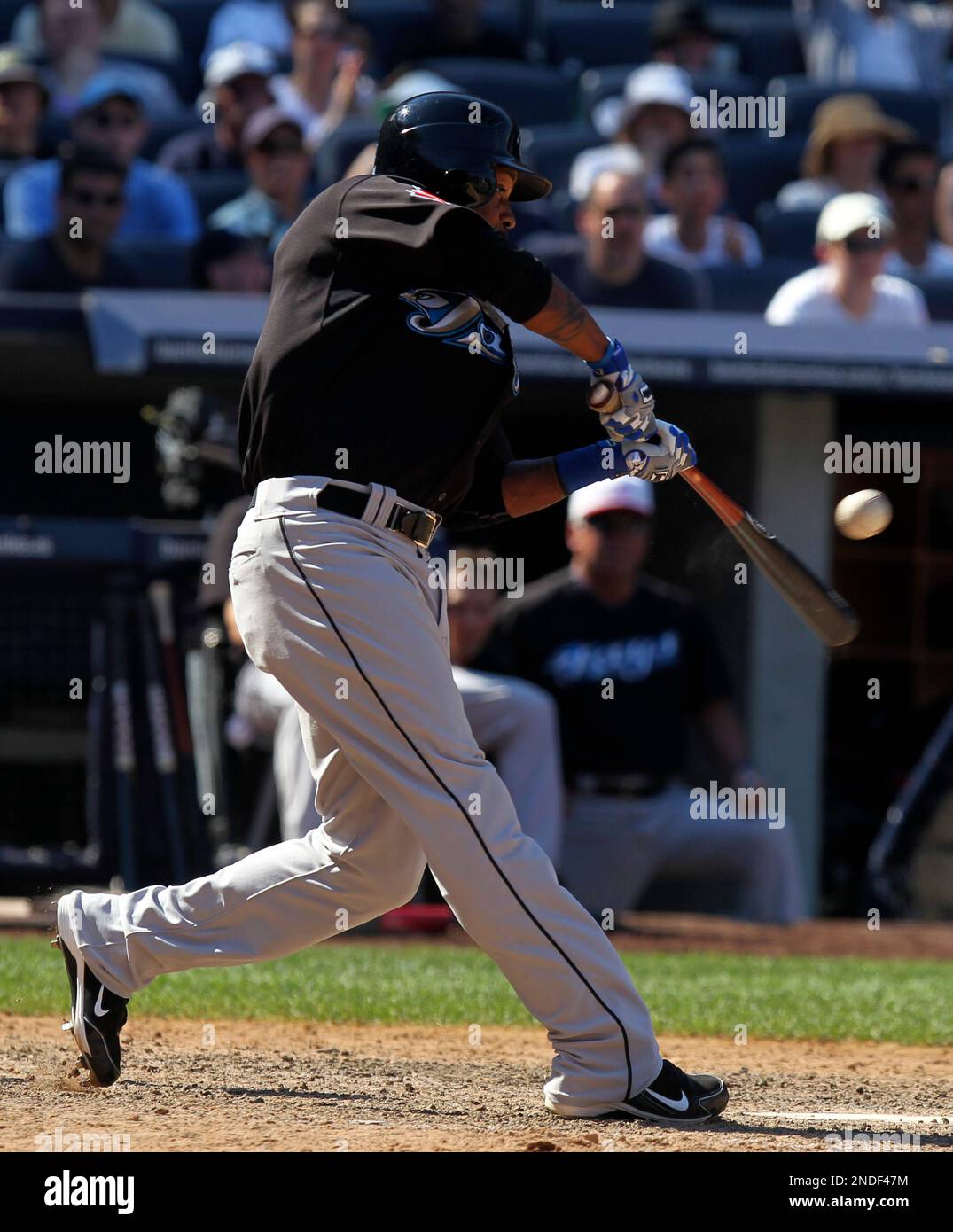 Toronto Blue Jays' Dewayne Wise hits a single to drive in a run to tie ...