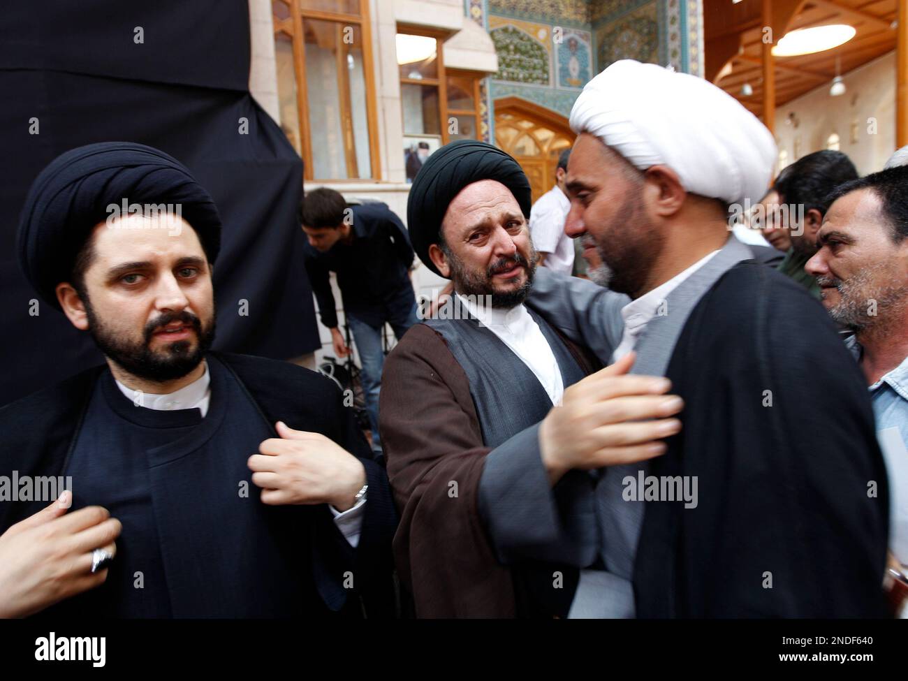 Sayed Jaafar Fdalallah, left, and his brother Sayed Ali, center, the ...
