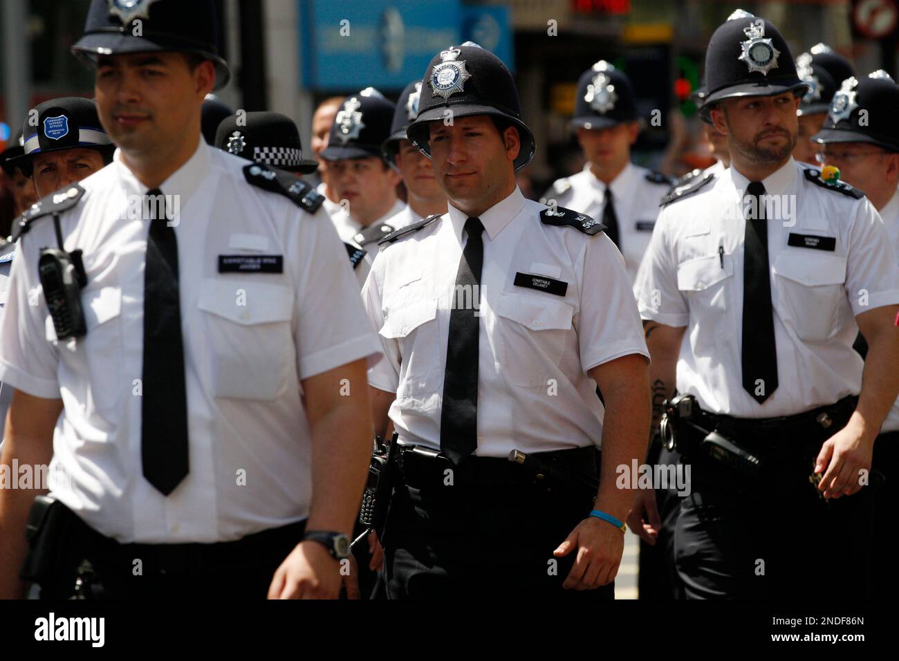 British police officers march through the streets of London during a ...