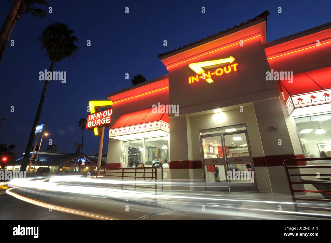 Cars exit the drive-thru at In-N-Out Burger on Friday, June 11, 2010 ...