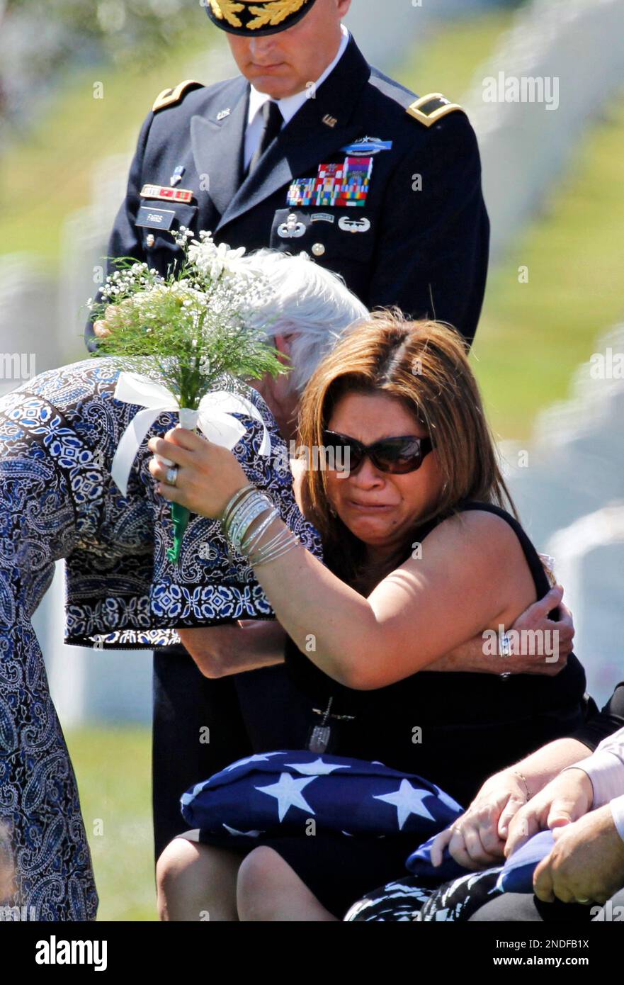 Elizabeth Blanchette, seated, widow of Army Staff Sgt. Michael J ...