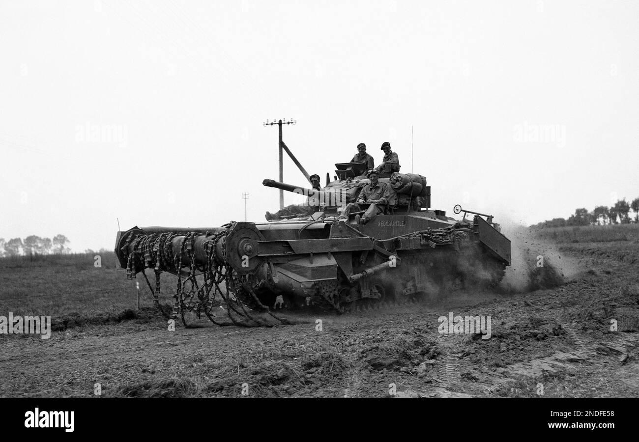 A flail tank which cleans paths through minefields by beating the ...