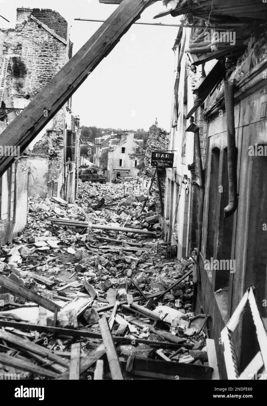 American tanks and armour rumbling through one of the wrecked streets ...
