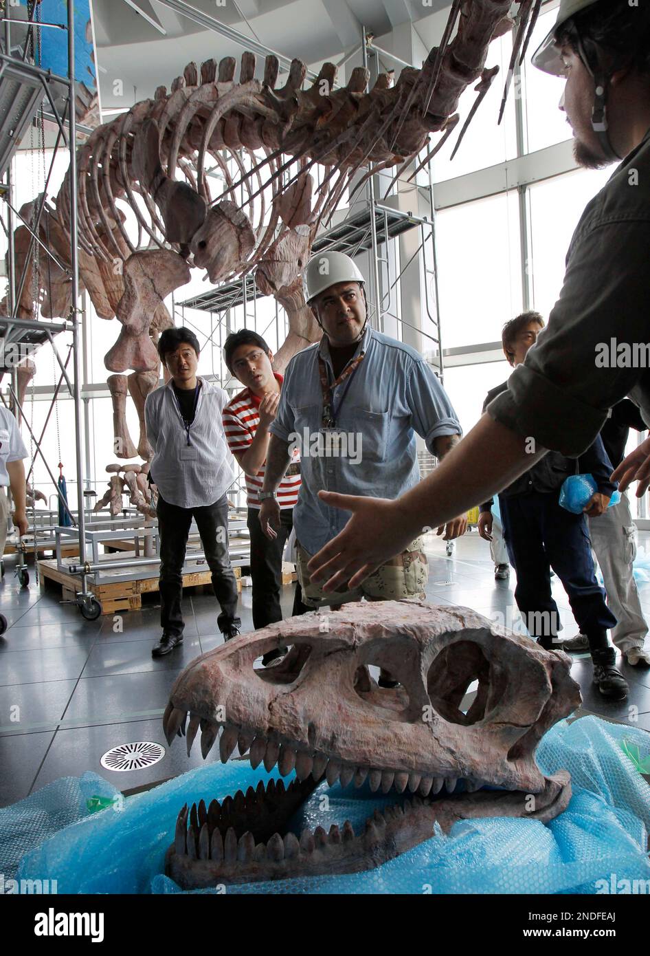 Argentine Museum of Natural Sciences engineer Renzo Dario Arce, right ...