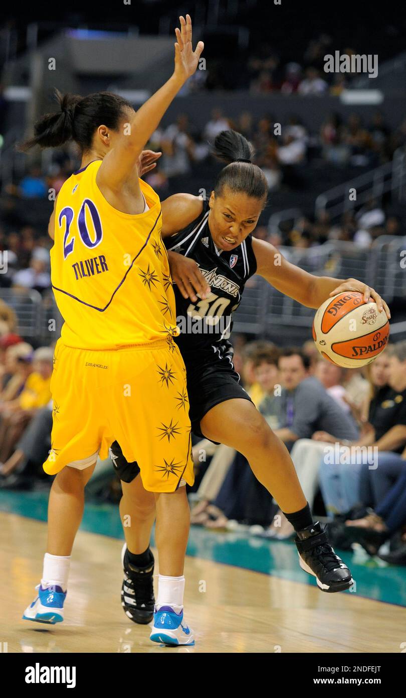 San Antonio Silver Stars' Helen Darling, right, tries to dribble around ...