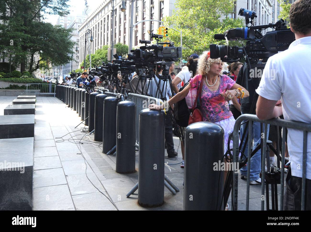 The media waits outside Manhattan federal court at the bail hearing of ...