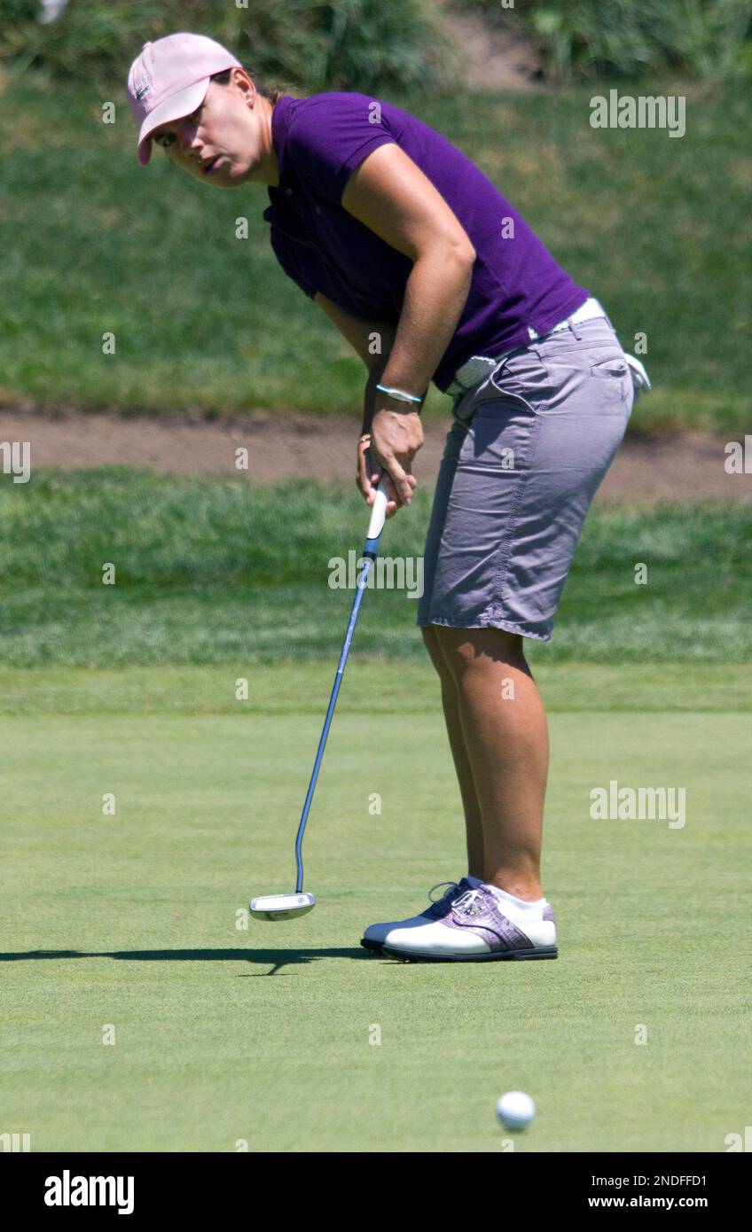 Karine Icher watches her putt on the eighth hole during the first round ...