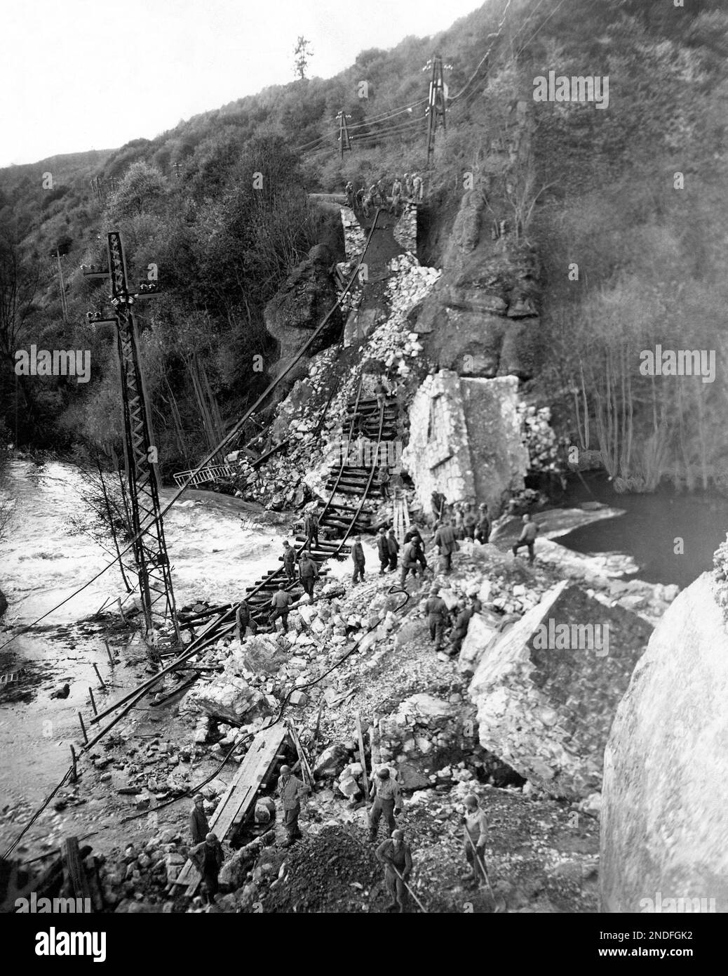 A Belgian Bridge blown out by the Nazis as U.S. Engineers are begin ...