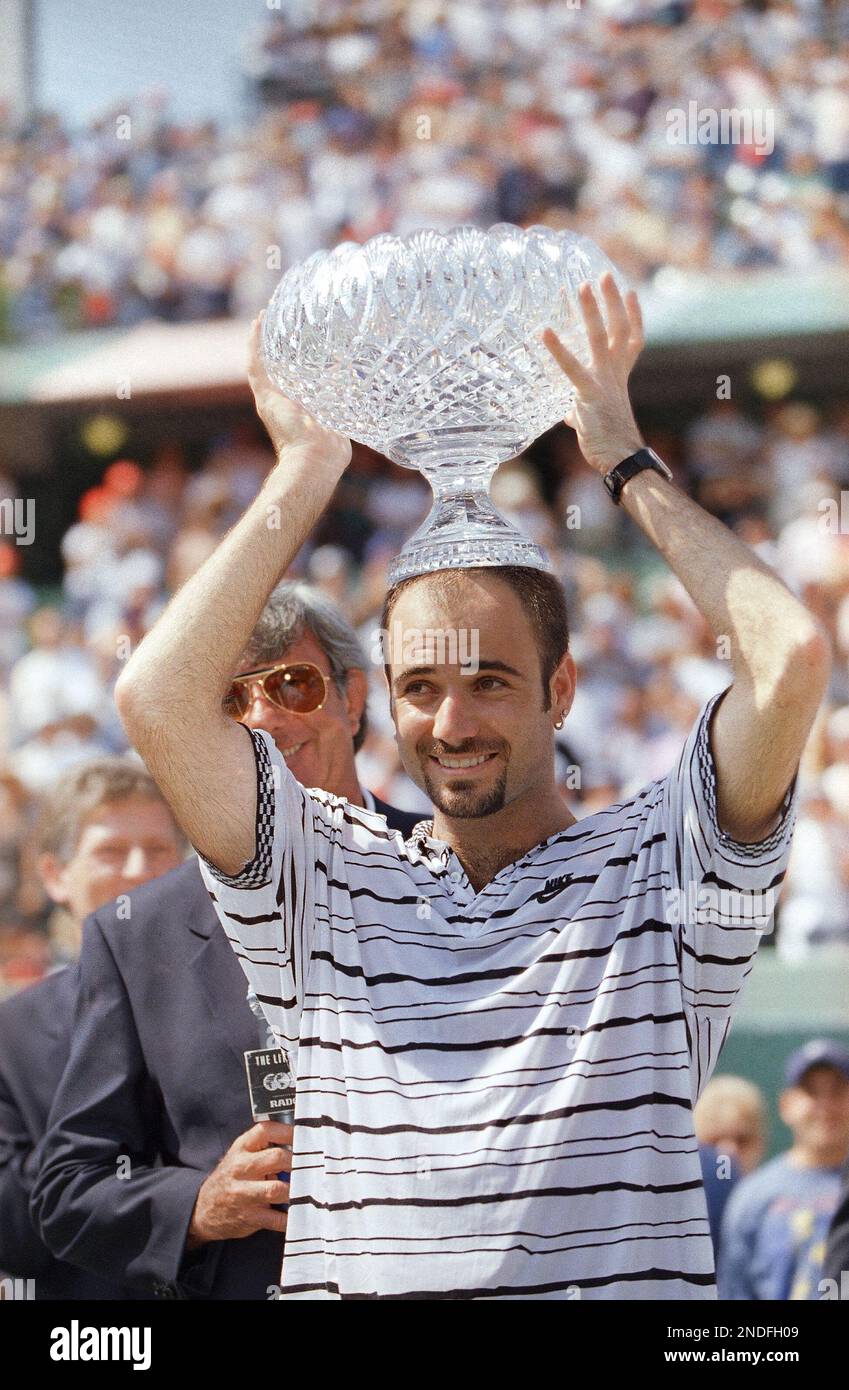 Andre Agassi balances his trophy on his head after winning the Lipton ...