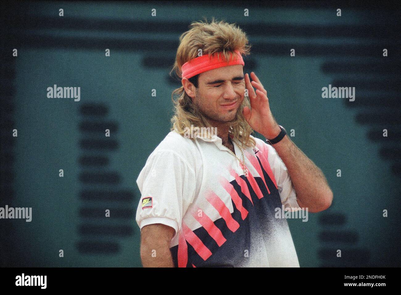 United State’s Andre Agassi grimaces after he missed a return shot to ...