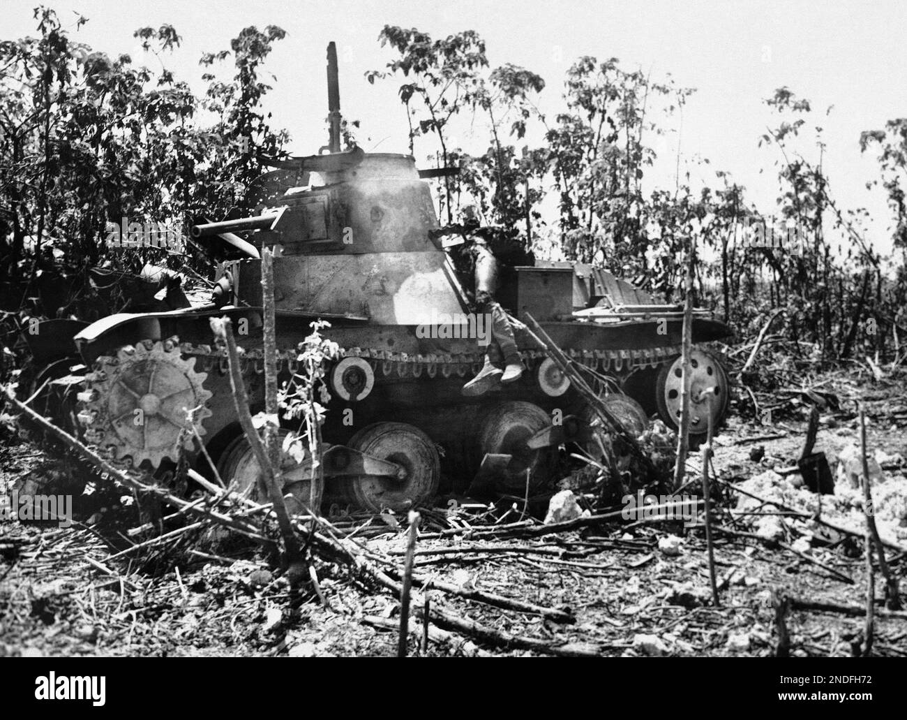 This Japanese tank, with the body of one of it’s crew hanging from the ...