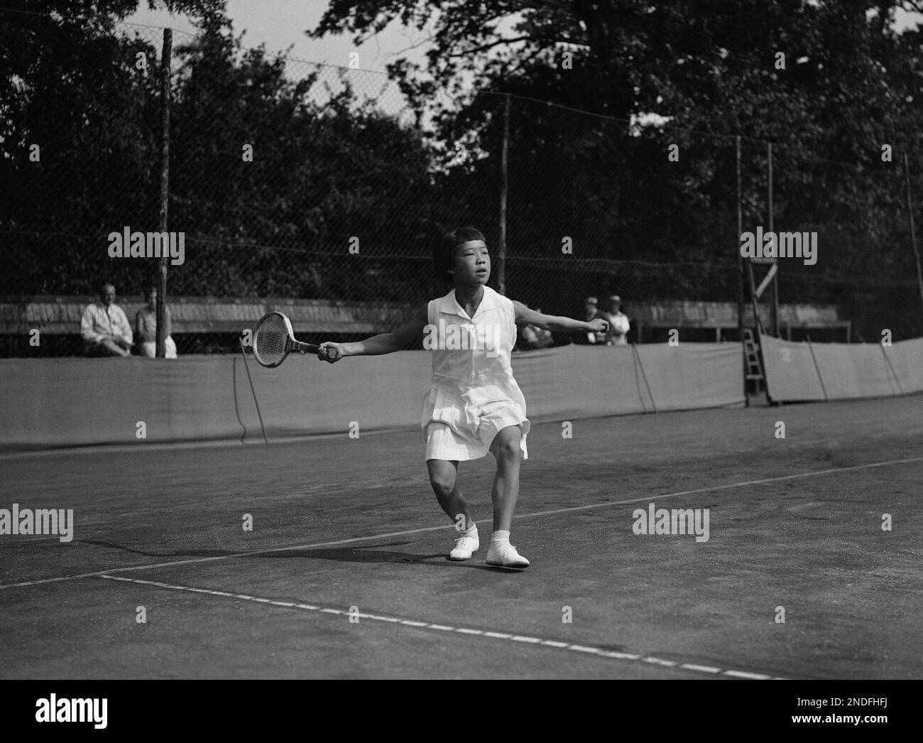 Miss G. Hoahing, 12 year old Chinese tennis player, competing in the ...