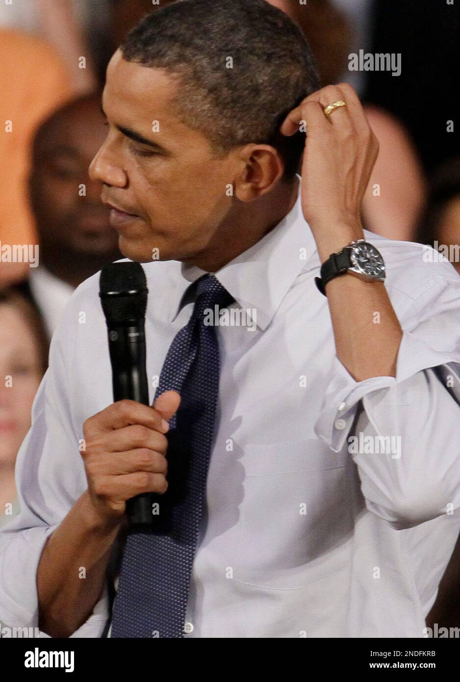 President Barack Obama scratches his head while answering a question ...