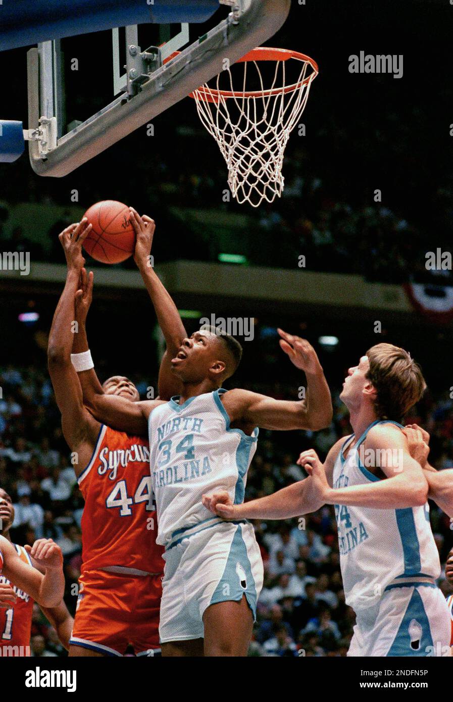 North Carolina’s J.R. Reid, right, fouls Syracuse’s Derrick Coleman in ...