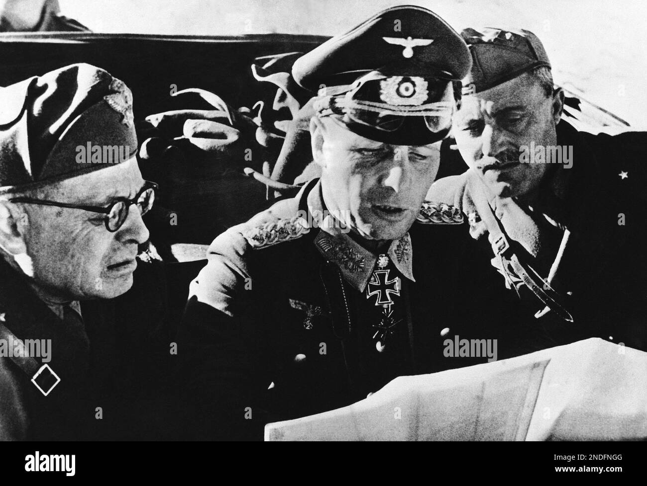 General field Marshal Erwin Rommel, center, confers with two Italian ...