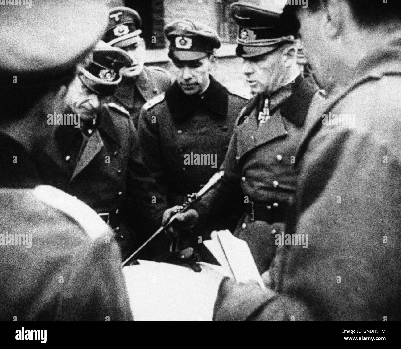 Marshal Erwin Rommel (with baton) inspects German defense map during ... Marshal Erwin Rommel (with baton) inspects German defense map during ...