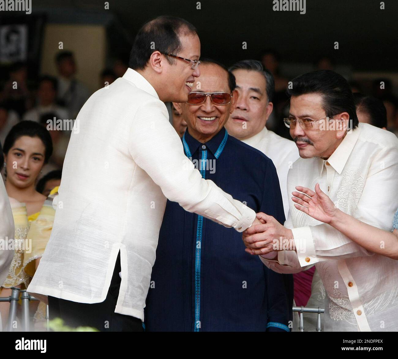President Benigno Aquino III, left, is congratulated by former ...