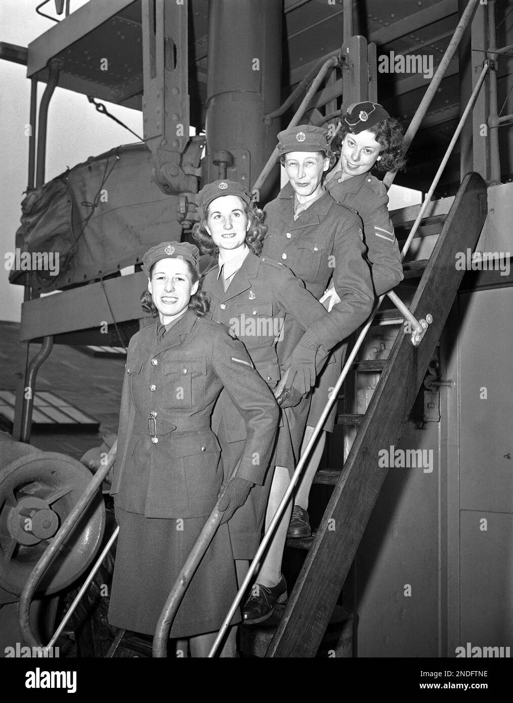 Girls from England who belong to the Auxiliary Territorial Service (A.T.C.) arrive in New York ...