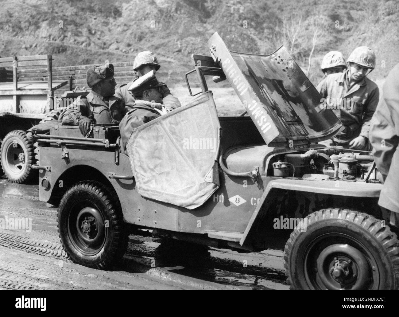 As Marines work on the engine which stalled in the Hongchon and caused ...