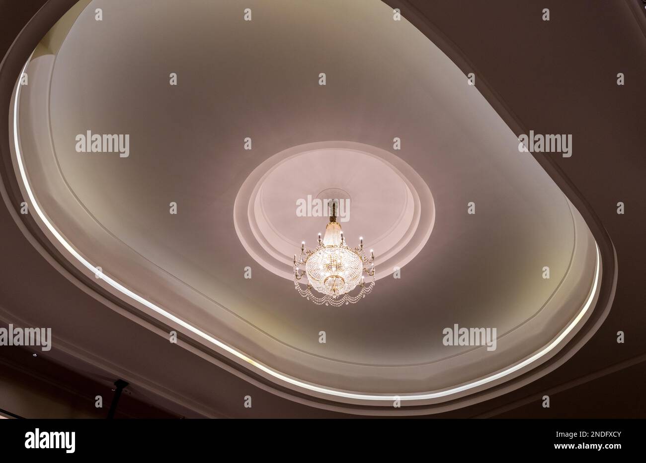 Chandelier hanging from ceiling in the old opera house or theater in ...