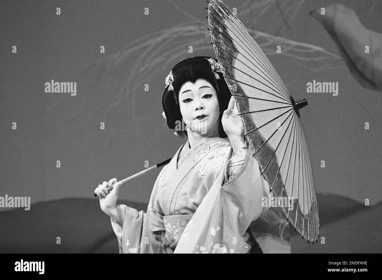 A geisha turns parasol into prop in this traditional dance performed at ...