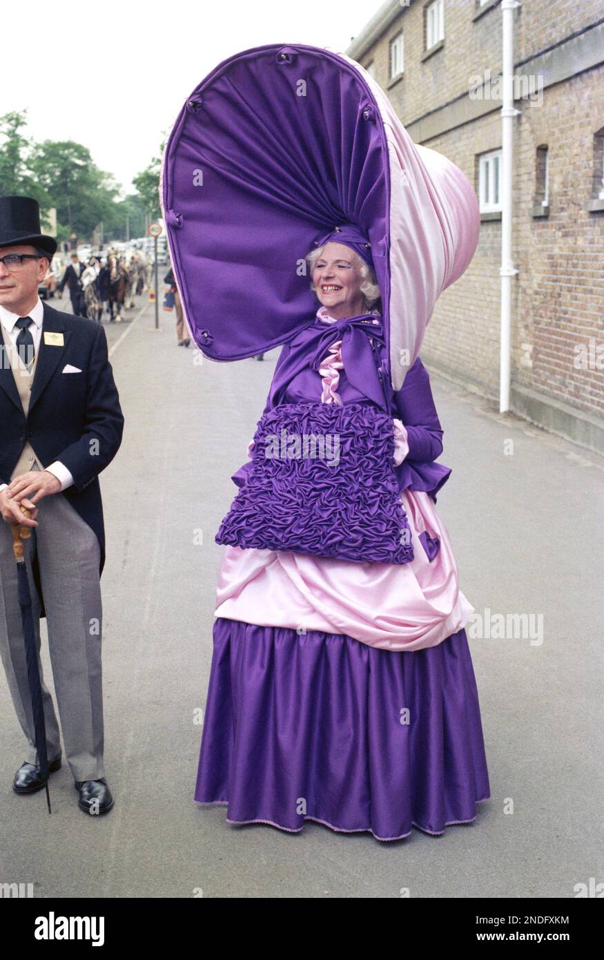 Mrs. Gertrude Shilling wears a giant size hat as she leaves her home in ...