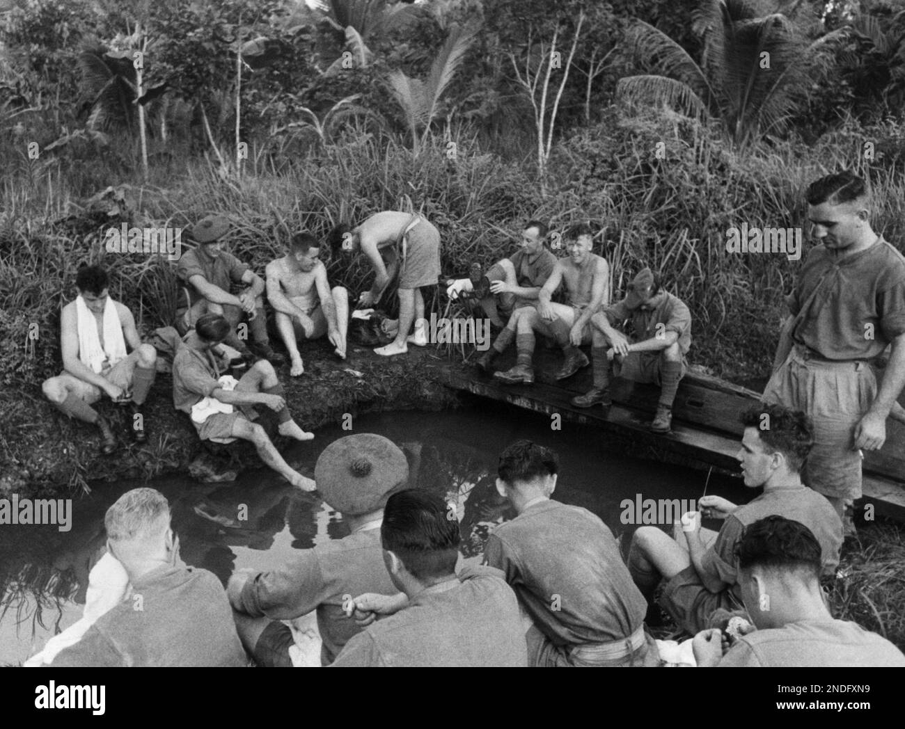 Scottish infantrymen cool their feet in pool after a day’s foot ...