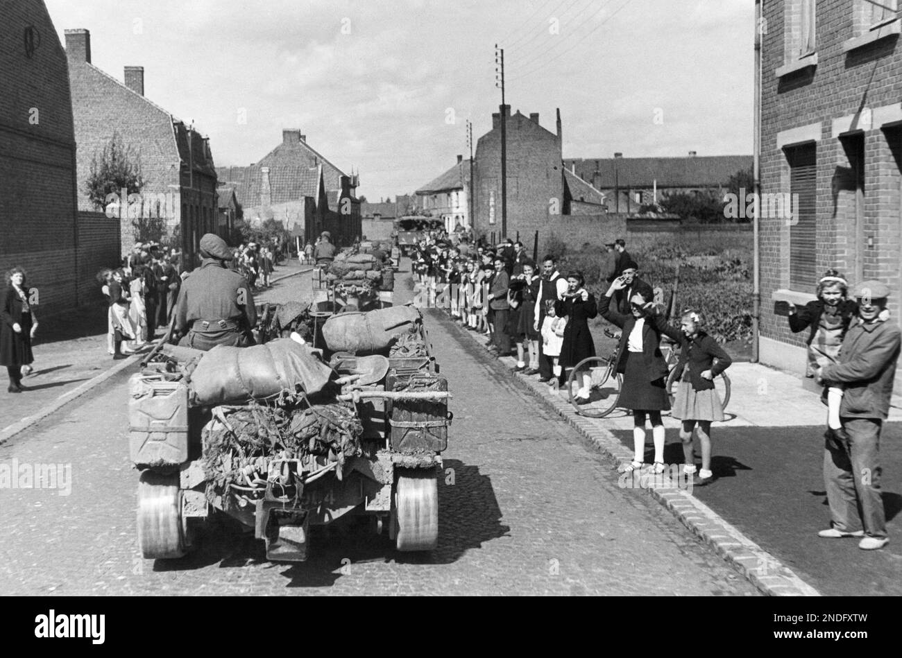 British armored troops pass through Arras on their way westwards to the ...