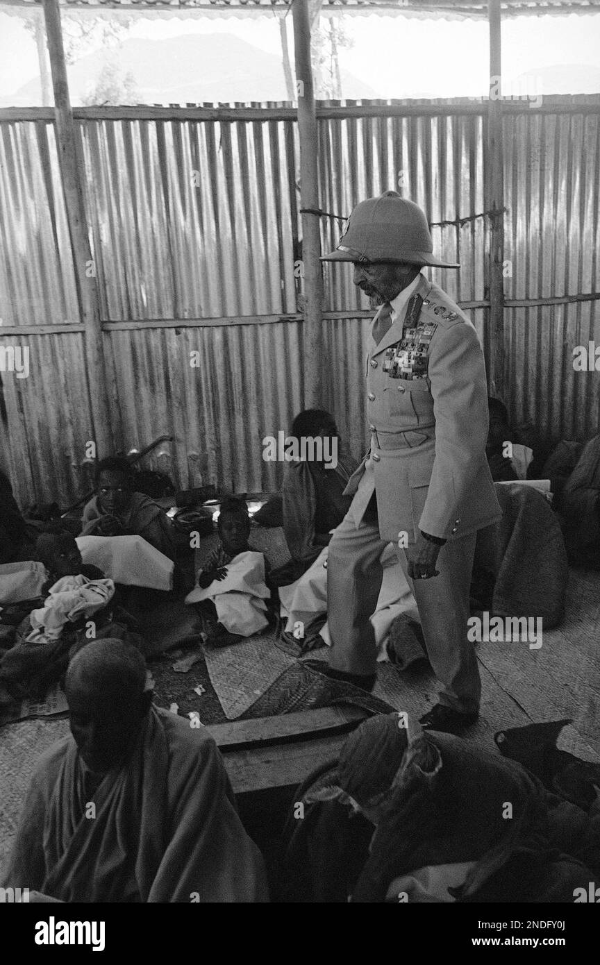 Emperor Haile Selassie visiting with drought victims at the Kombolchie ...
