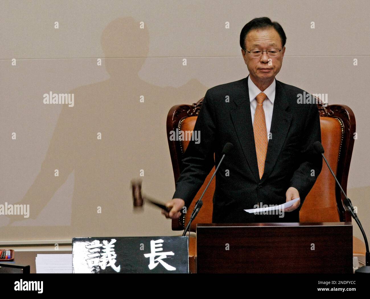 Speaker Park Hee-tae uses a gavel to announce the passing of a bill of ...