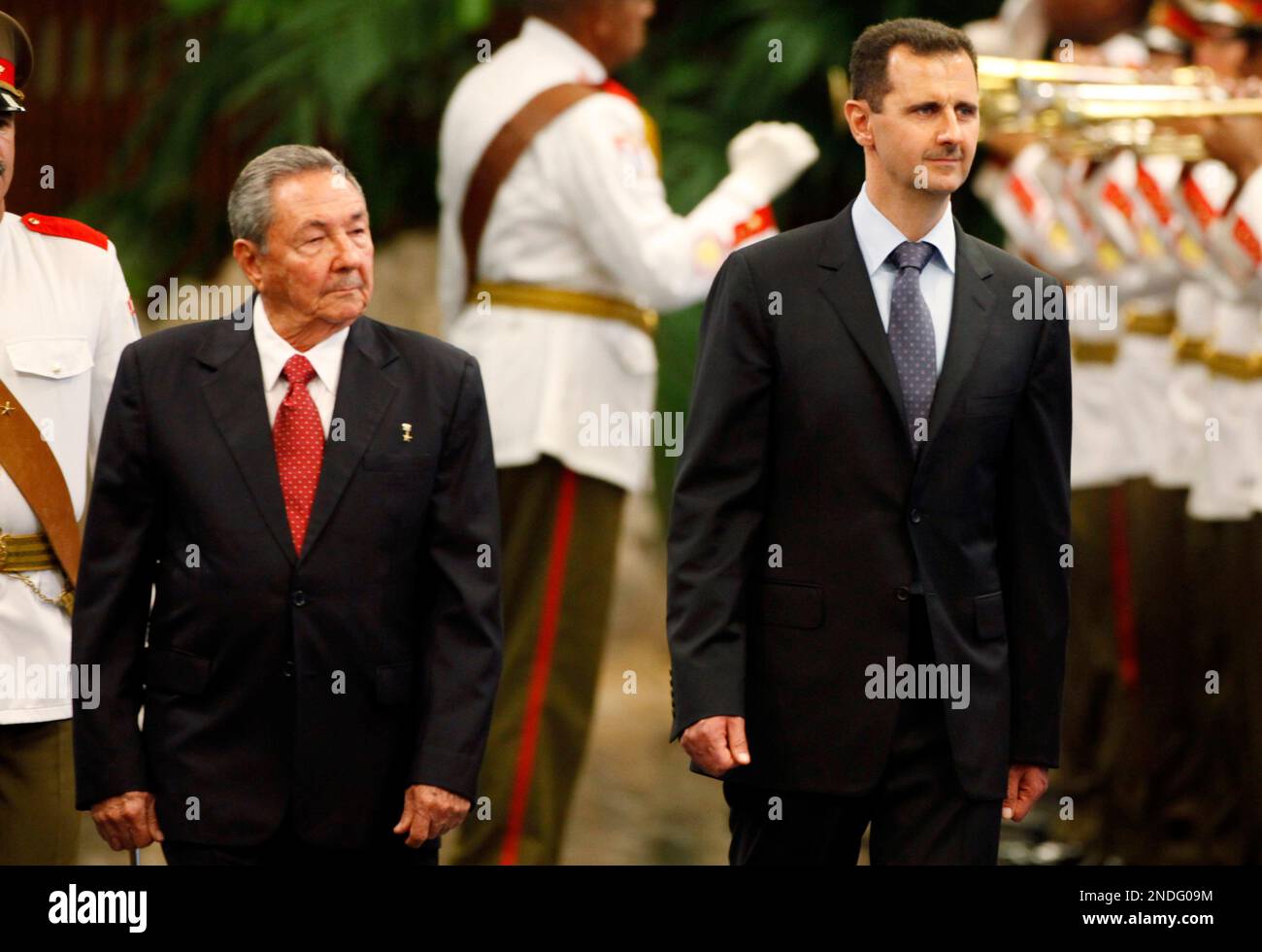 Cuba's President Raul Castro, left, and Syria's President Bashar al ...