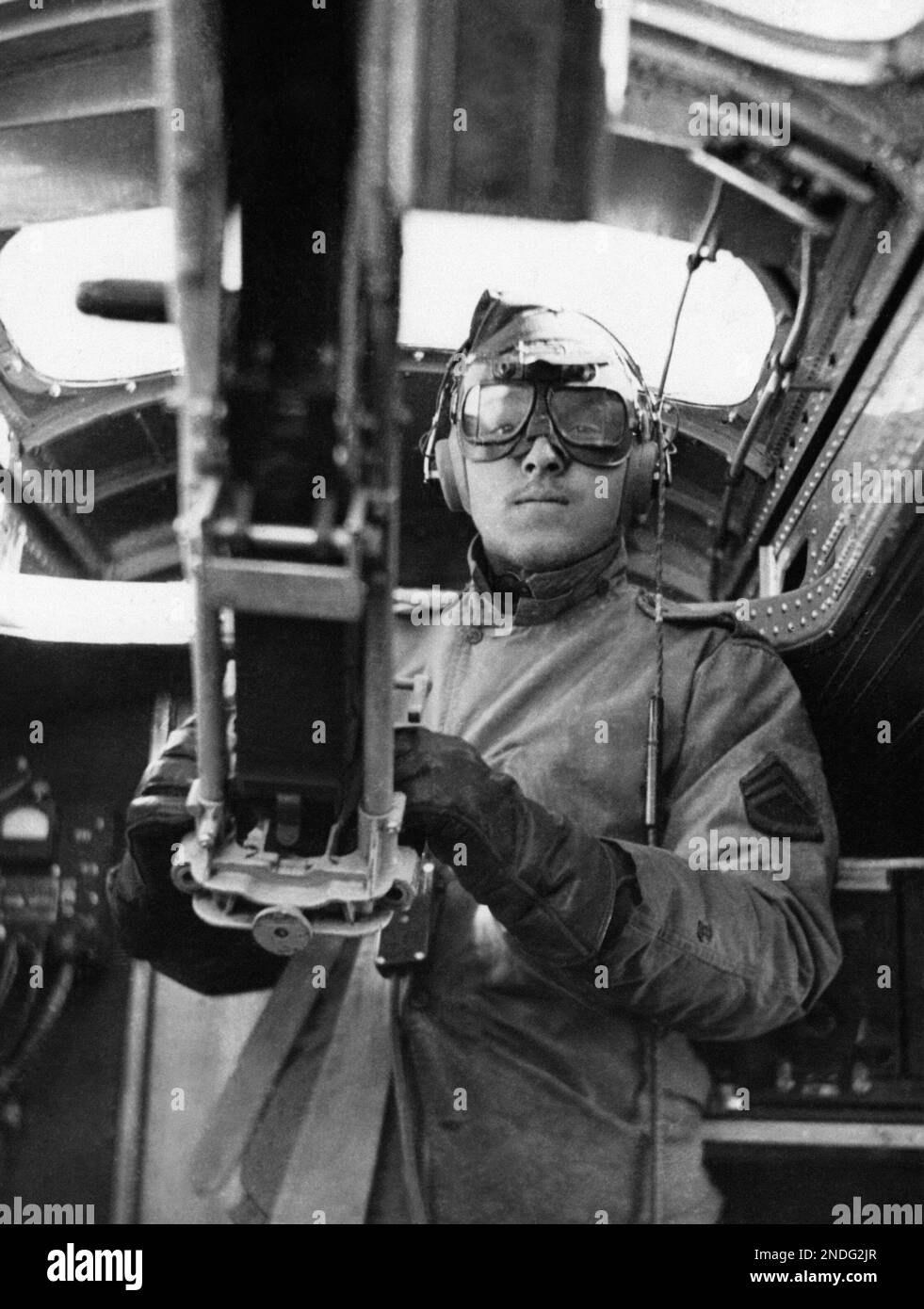 Radio operator-Gunner William J. Garrett, 24, of Youngstown, Ohio, in ...