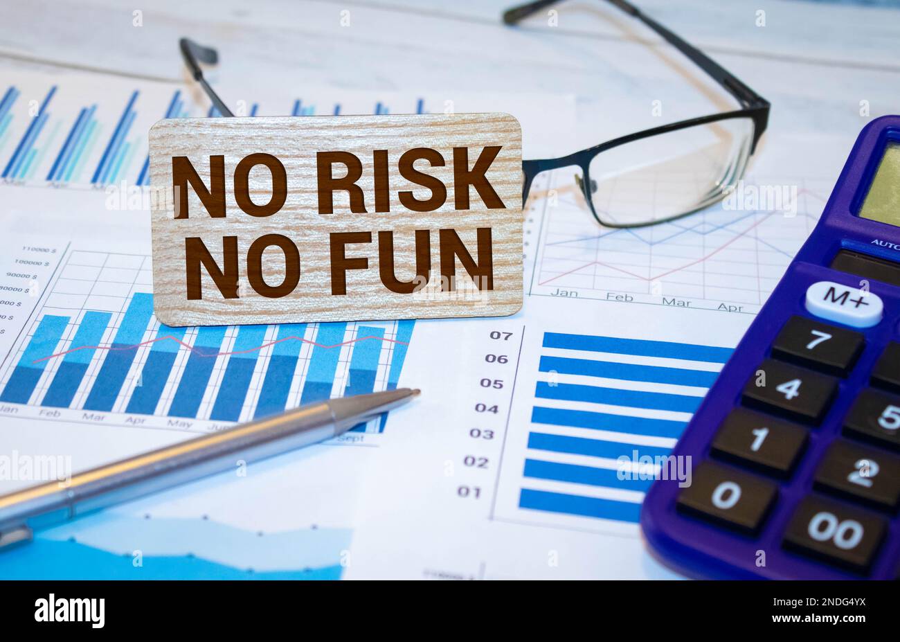 the inscription no risk no fun on the background of economic graphs ...
