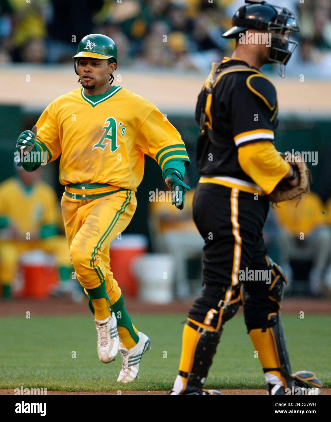 Oakland Athletics' Coco Crisp, left, scores behind Pittsburgh Pirates ...