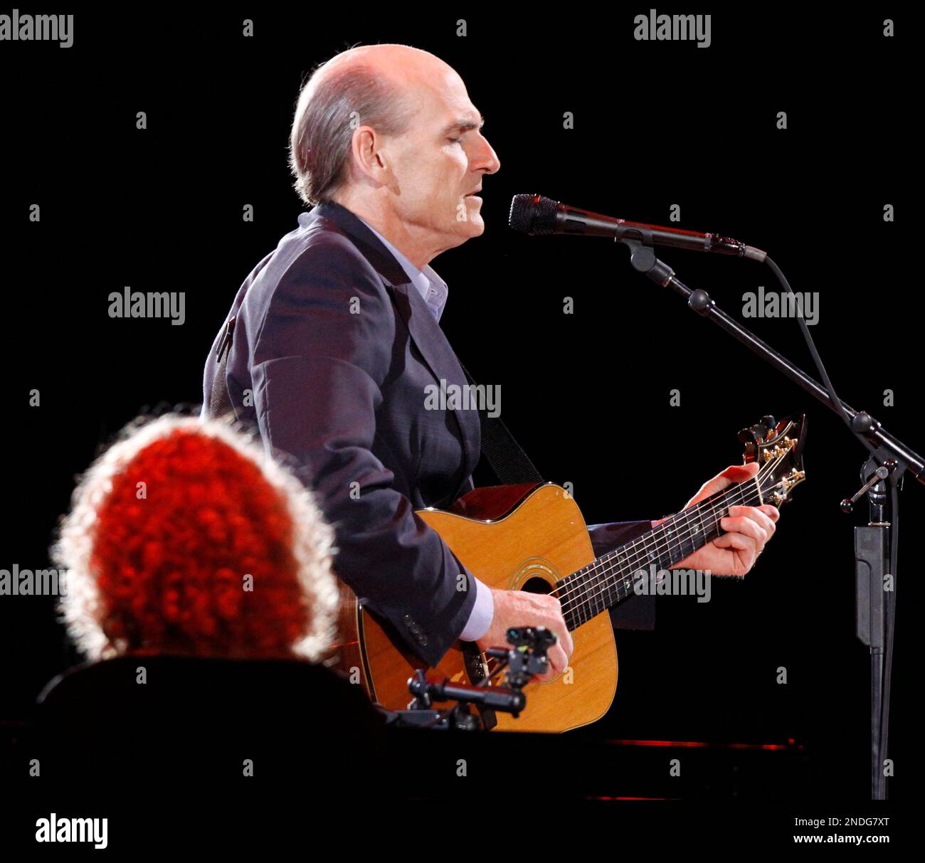 James Taylor, right, and Carole King perform at the last event ...