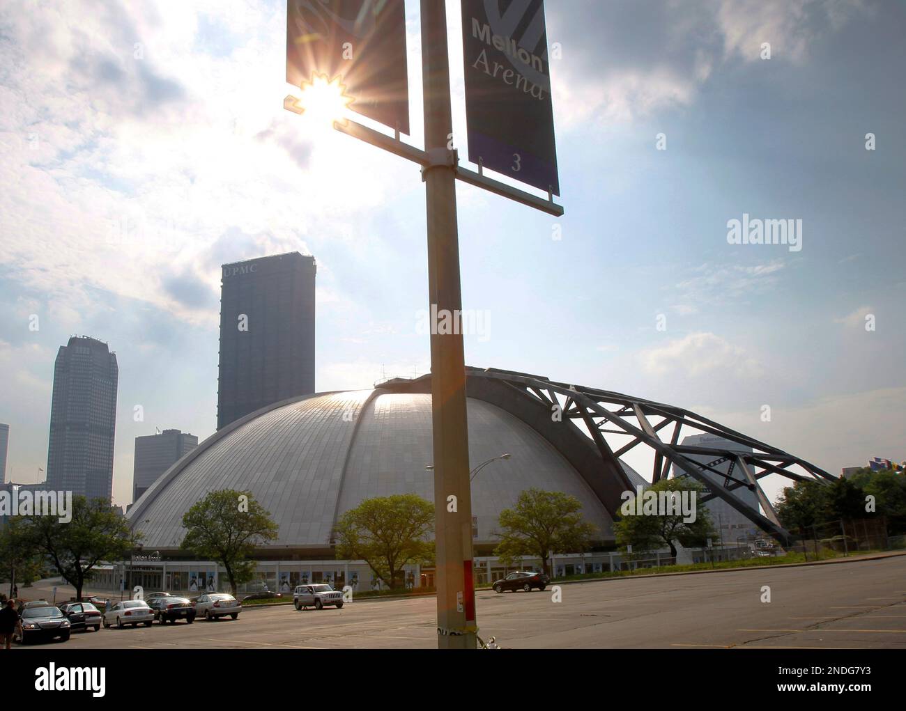 The sun shines between the signs of the parking lot before James Taylor ...
