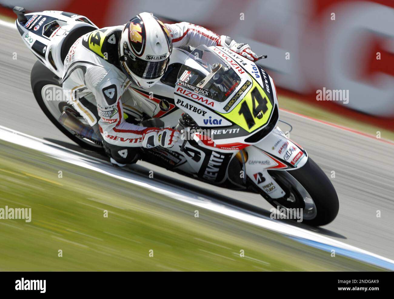 Randy de Puniet of France steers his Honda motorcycle during the MotoGP ...
