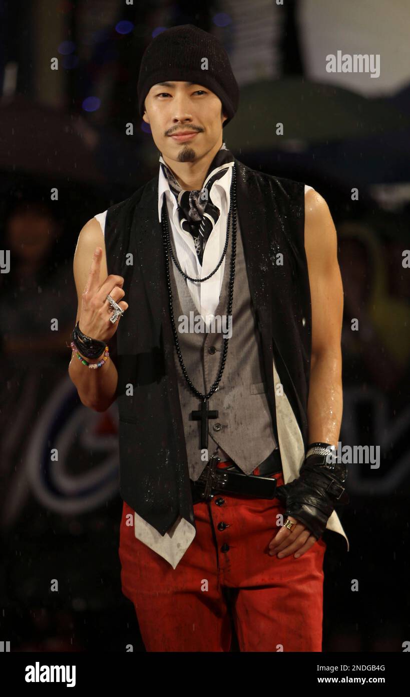 Taiwanese singer Vanness Wu smiles as he arrives for the 21st Golden ...