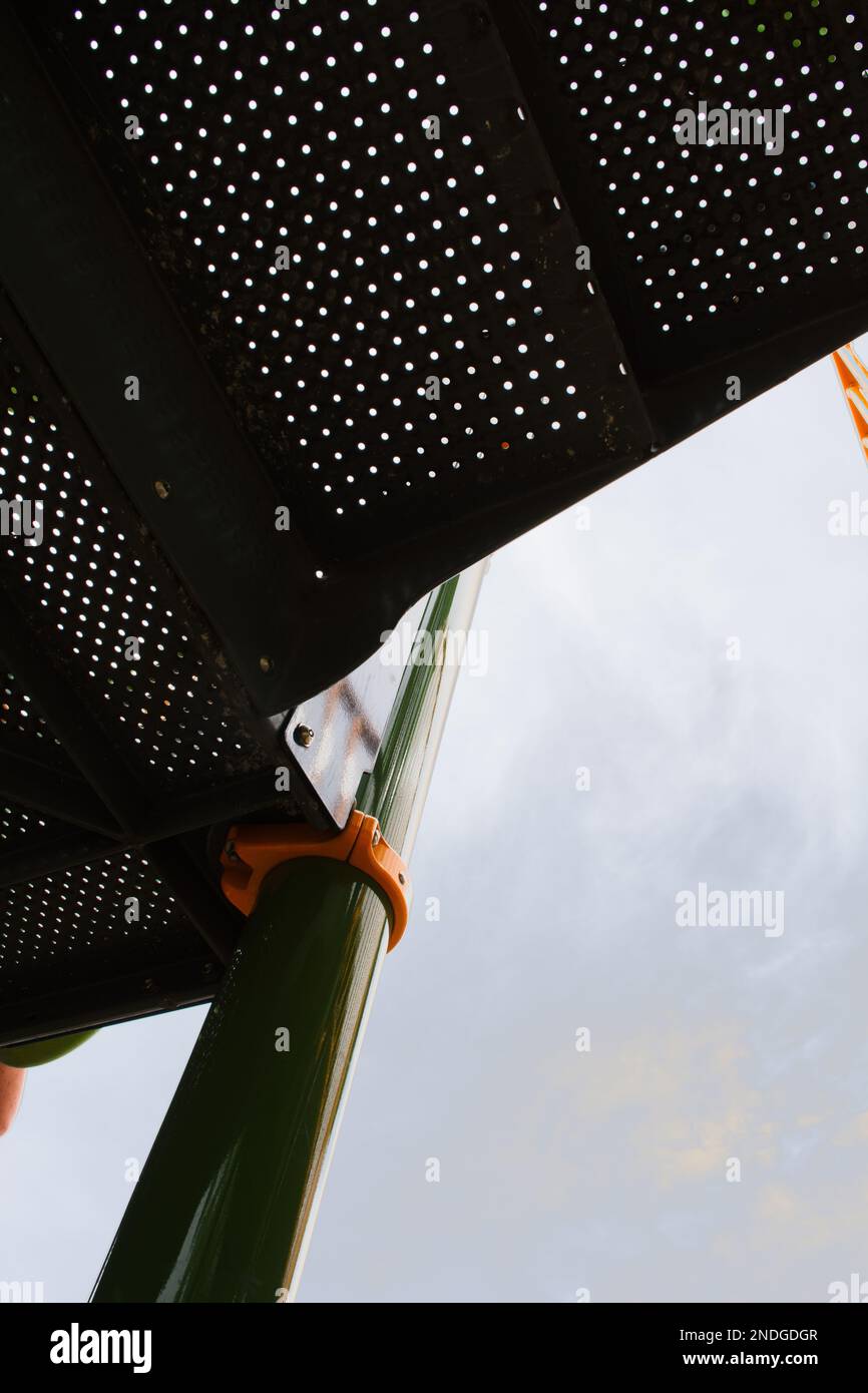 A vertical low angle shot of playground equipment with the sky Stock ...