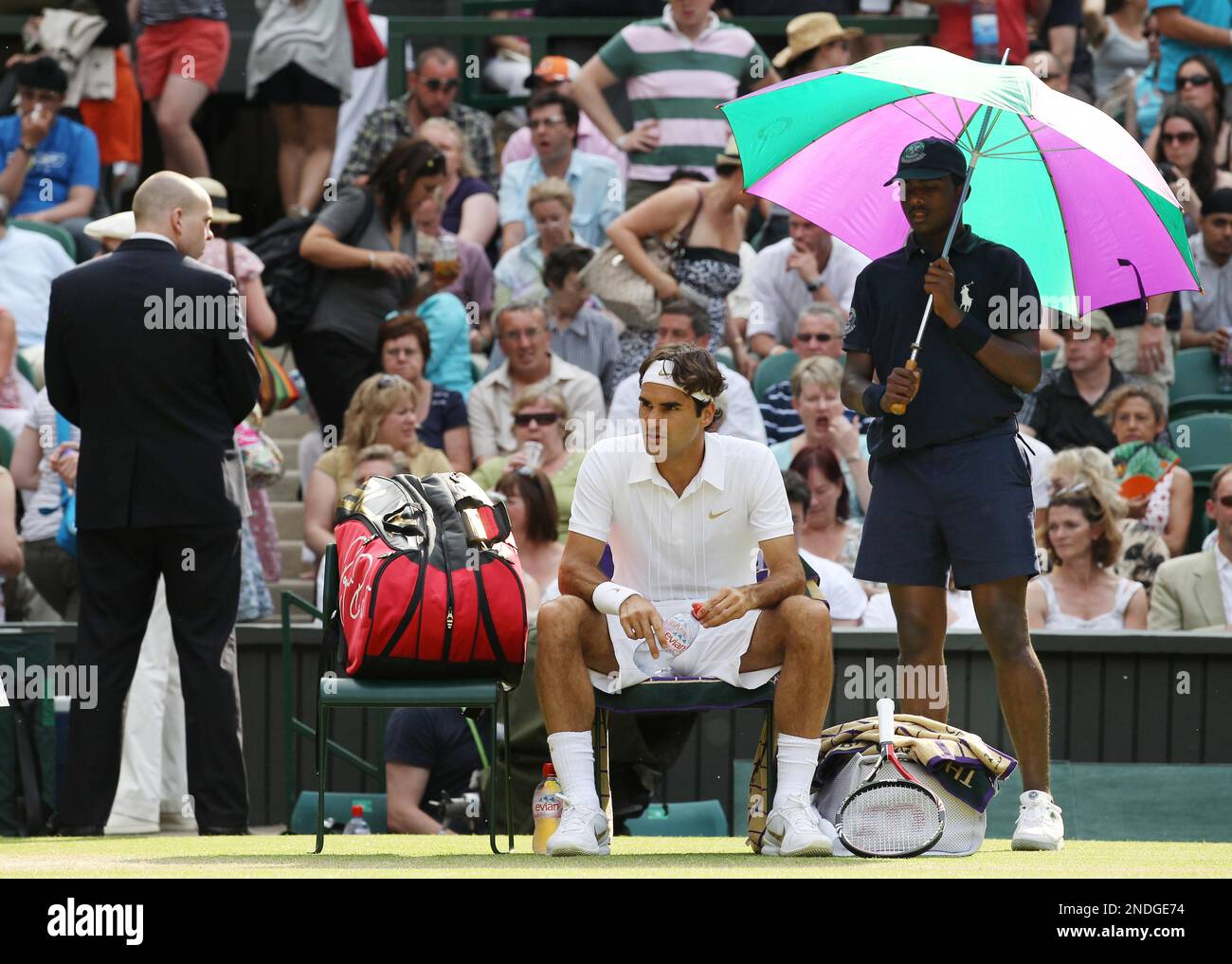 Switzerland's Roger Federer sits in his chair between games against ...