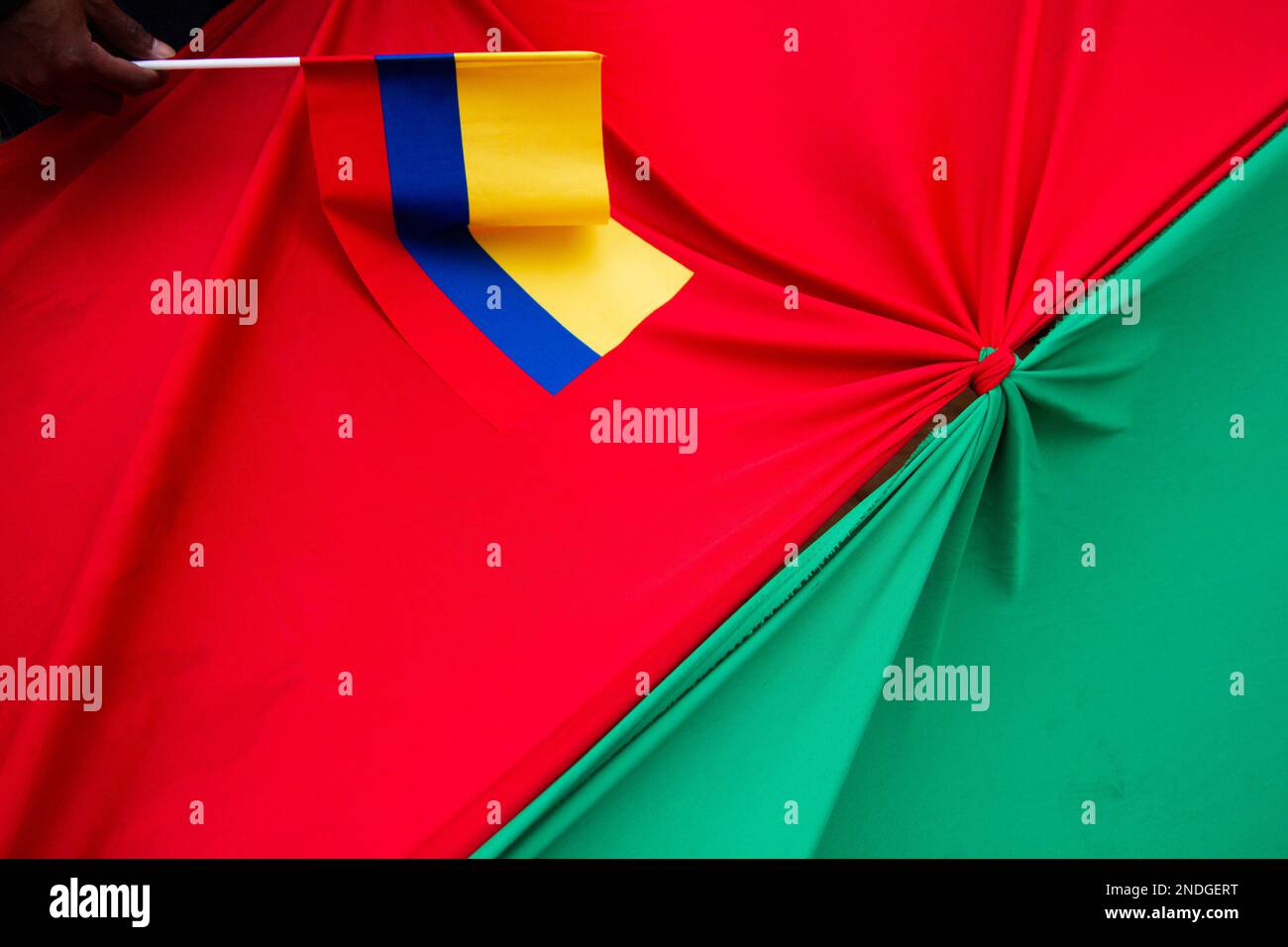 A demonstrator holds a Colombian flag during a demonstration to support ...