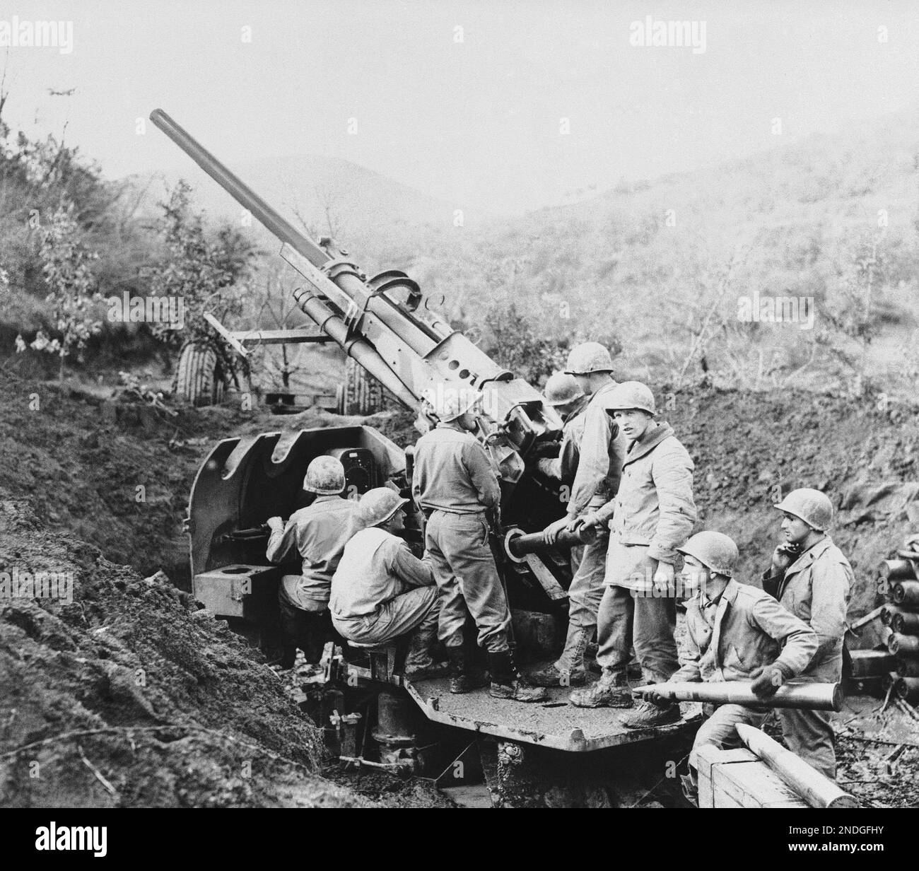 The 90 millimeter gun being fired by an American anti-aircraft ...