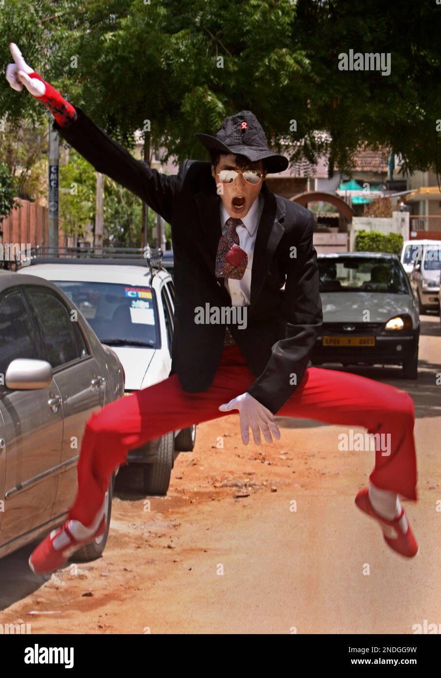Munna Kesari, a Michael Jackson impersonator, dances in front of the ...