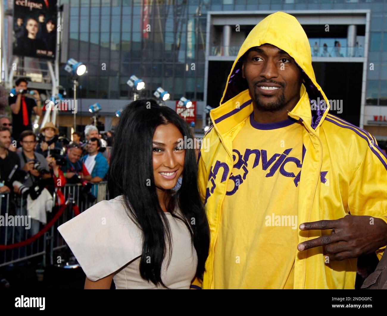 Ron Artest, right, and an unidentified guest arrive at the premiere of ...