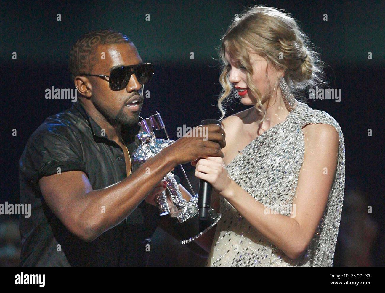 FILE- In this Sept. 13, 2009 file photo shows singer Kanye West taking ...